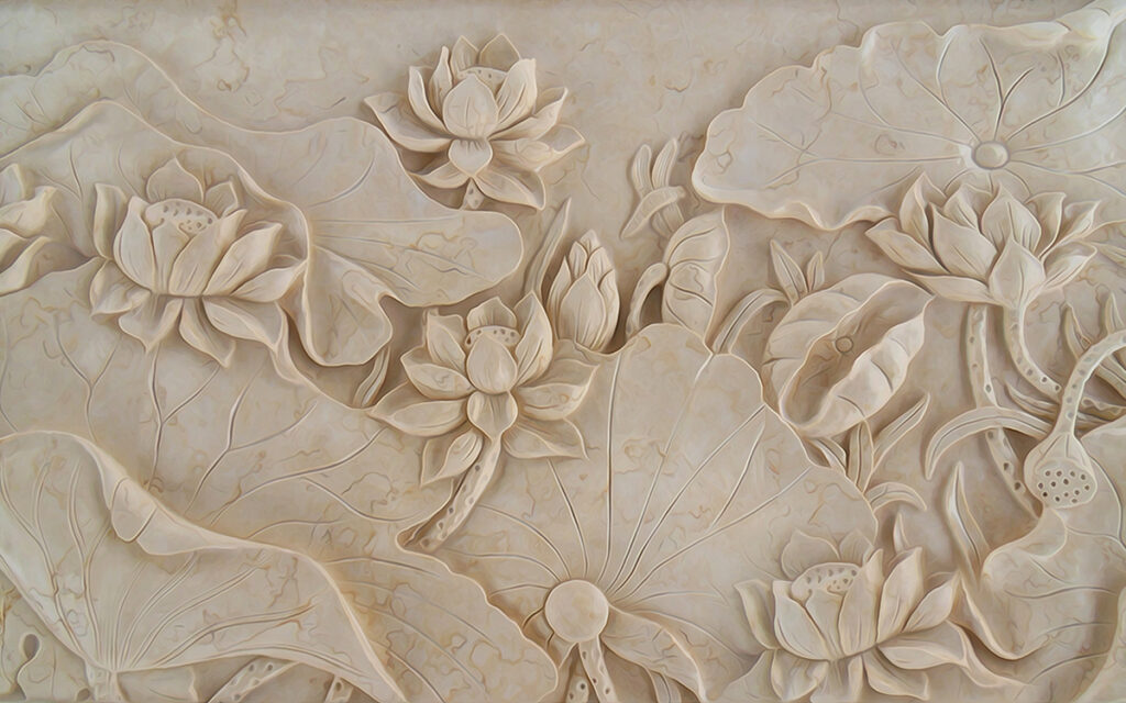 A stone carving of flowers and leaves - Magicdecor®