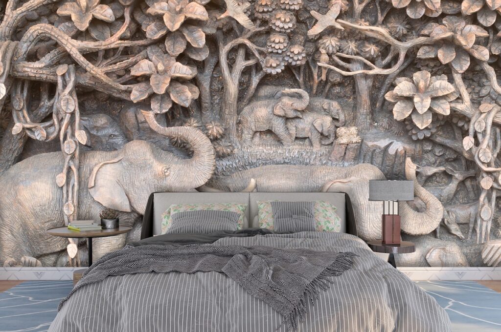 A group of elephants carved into a wall - Magicdecor®