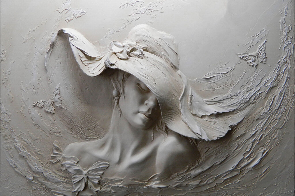 A sculpture of a woman in a hat - Magicdecor®