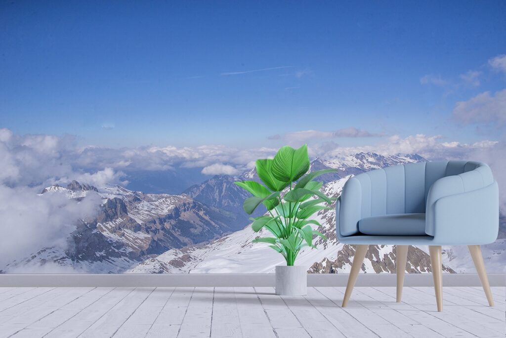 A snowy mountain tops with clouds in the sky - Magicdecor®