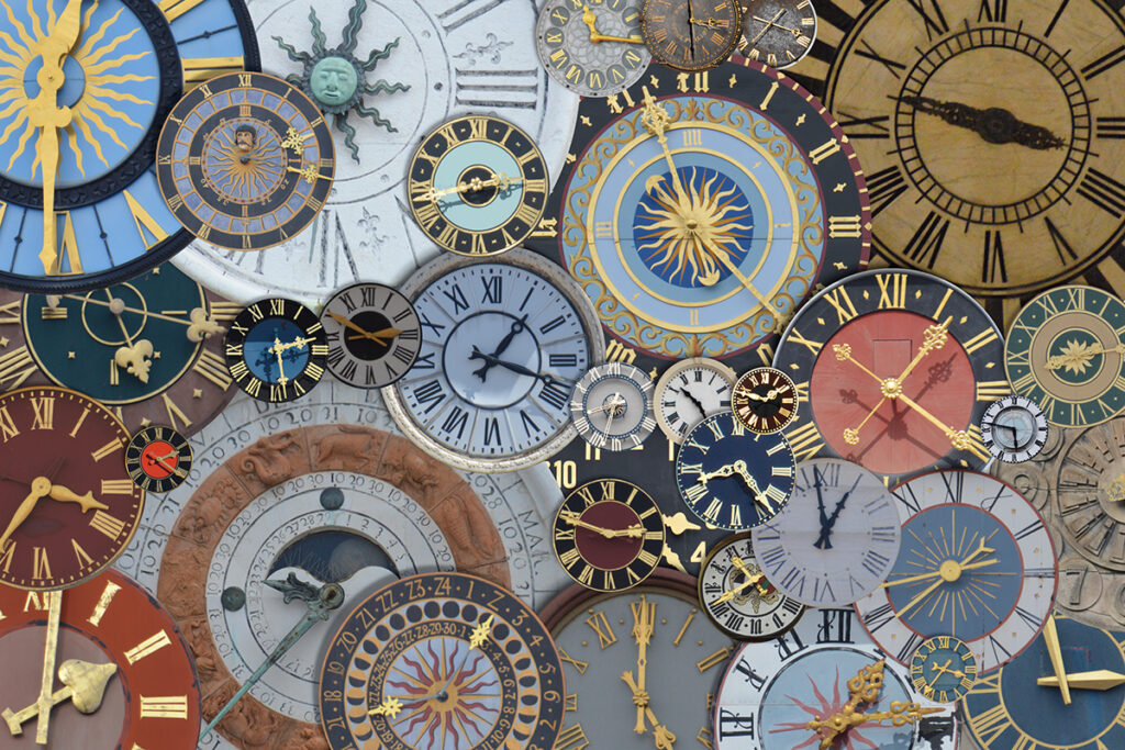 A group of clocks with roman numerals - Magicdecor®